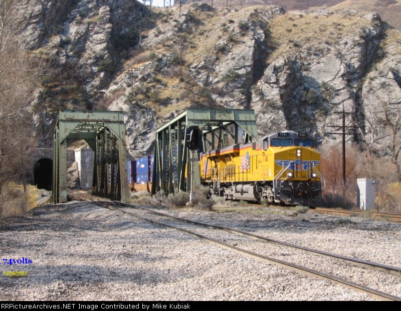 UP 7141 exiting a tunnel and crossing the bridge going east through Weber Canyon near